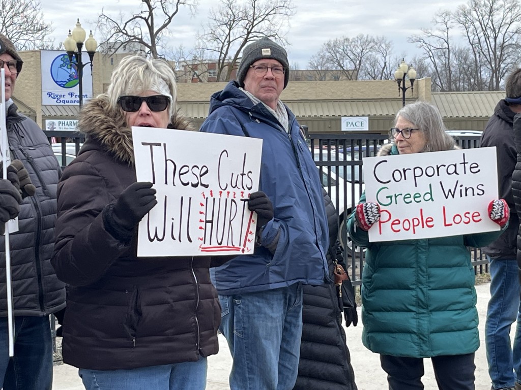 Protesters rally outside Rep. Walberg’s office against federal budget ...